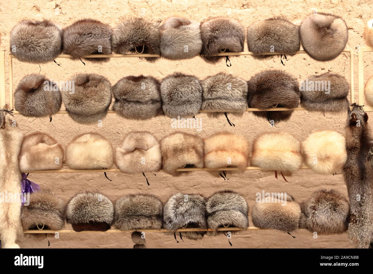 Sale of fur caps in a market in uzbekistan Stock Photo - Alamy