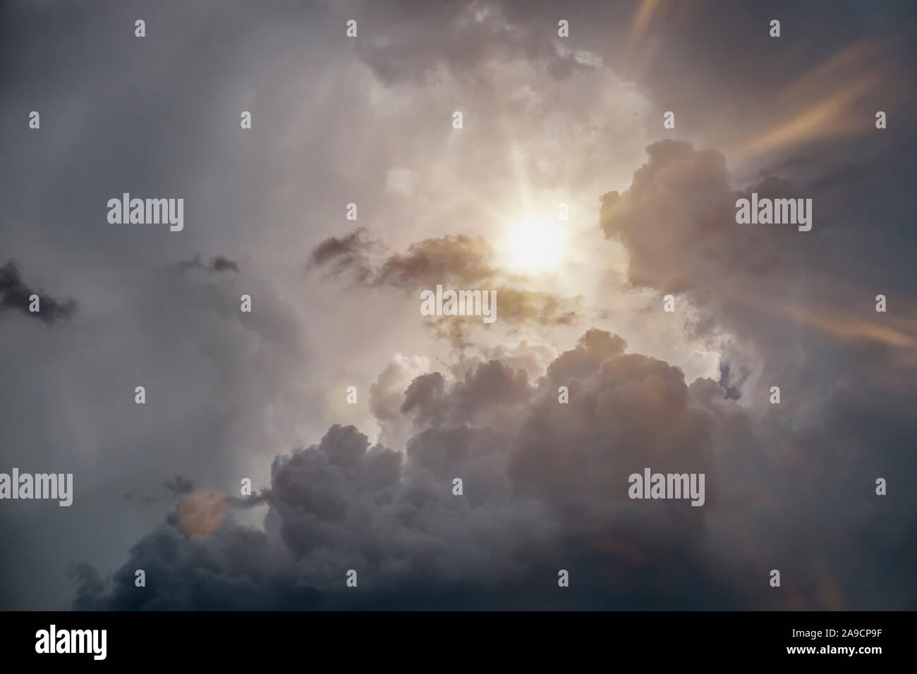 An image of a dramatic grey sky with sun Stock Photo - Alamy
