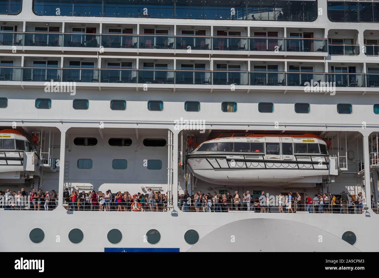 People lining up on deck to leave cruise ship MSC Lyrica Stock Photo ...