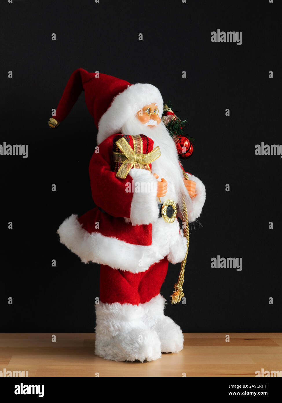 An image of a Santa Claus figure side view Stock Photo - Alamy