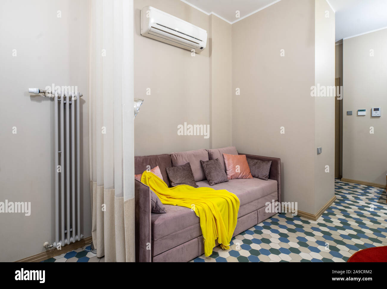 Cozy sofa. Spacious apartment. Heating system Stock Photo - Alamy