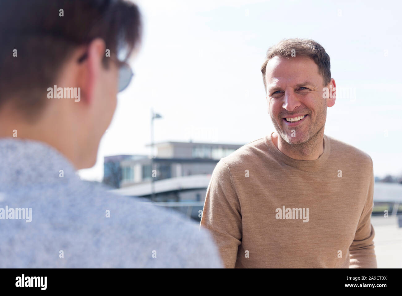 Father, son, adult, smile, eye contact, portrait Stock Photo - Alamy