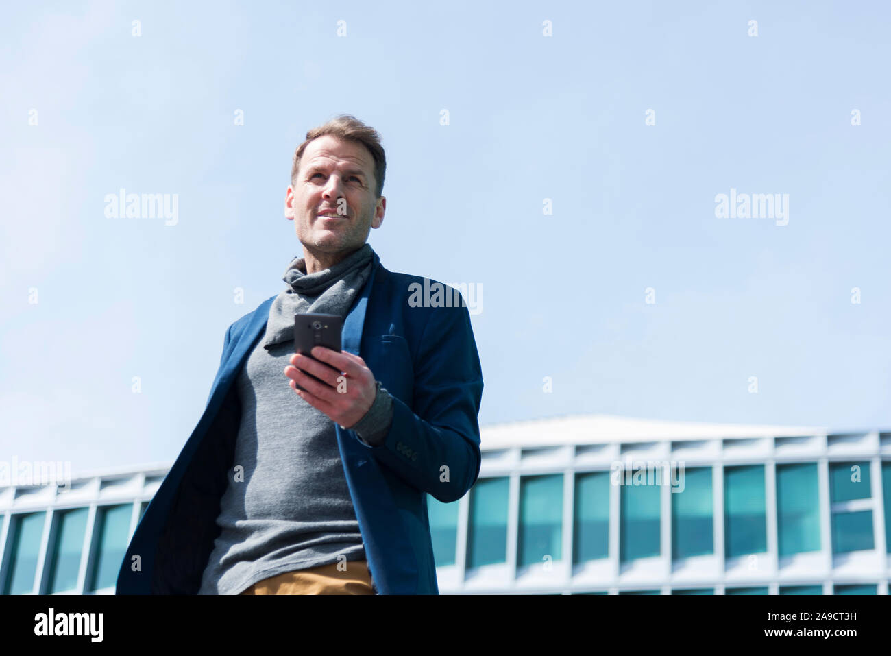 Business man, mobile phone, half portrait Stock Photo - Alamy