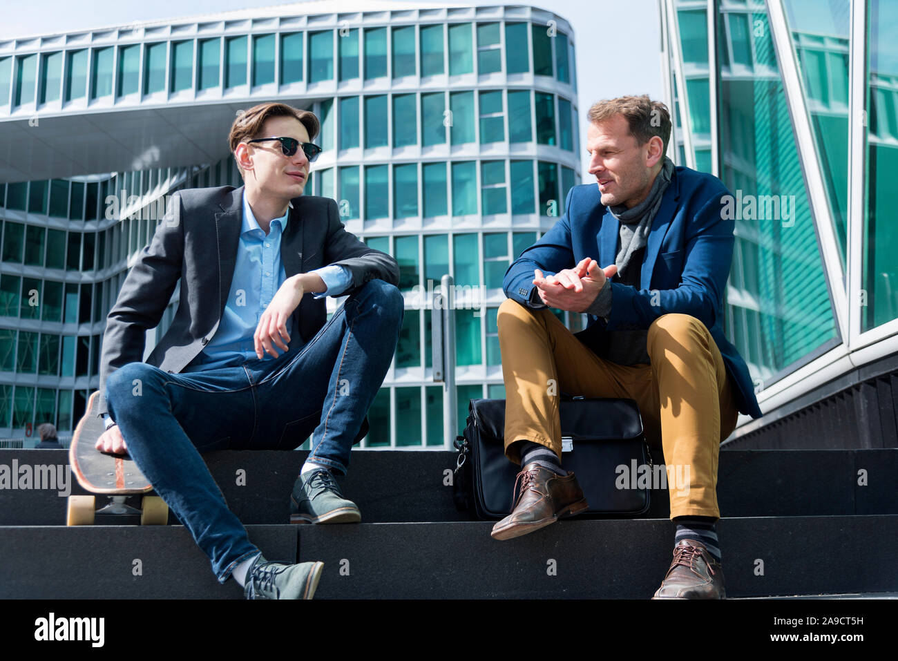 Businessmen, two, stairs, sit Stock Photo - Alamy
