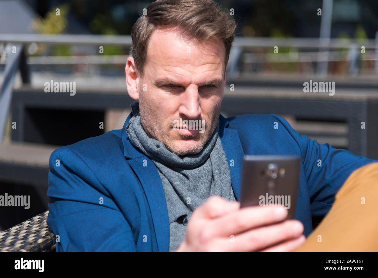Business man, mobile phone, portrait, outside Stock Photo - Alamy