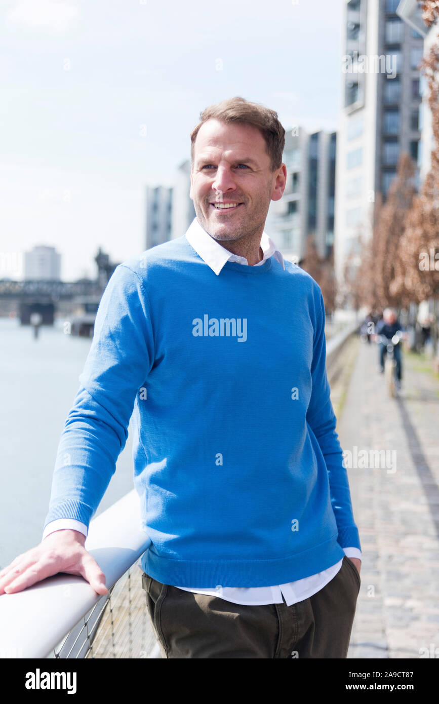 Business man, riverside, railing, lean against, half portrait Stock ...