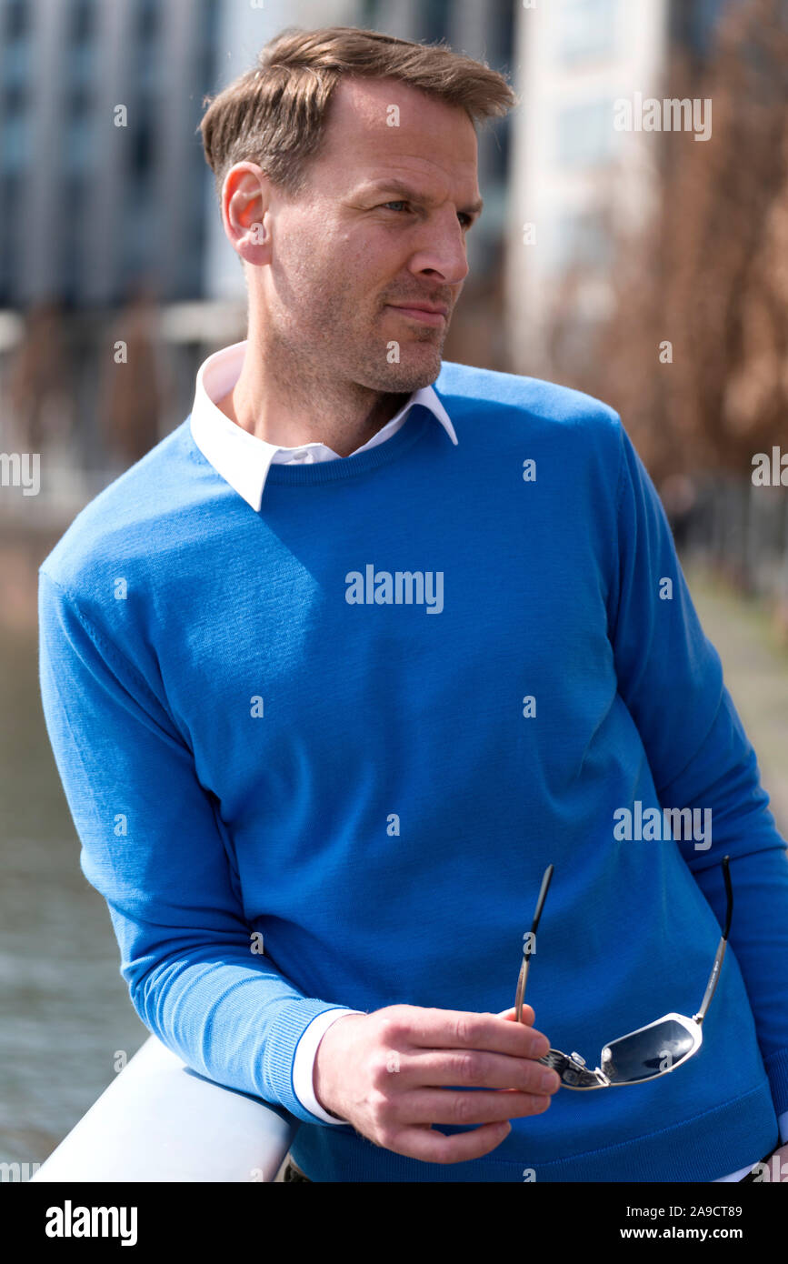 Business man, riverside, railing, lean against, half portrait Stock ...