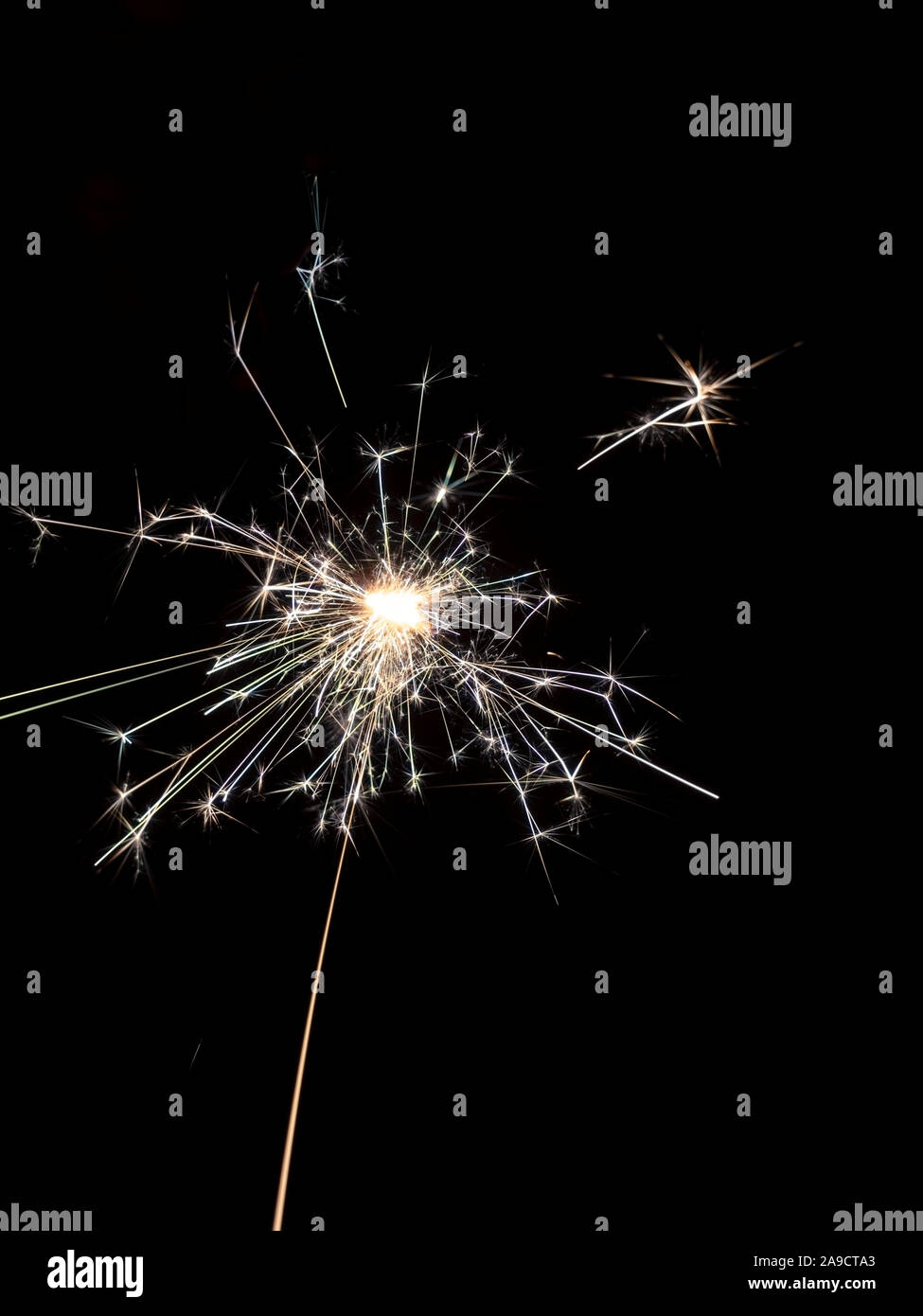 An image of a typical sparkler with dark background Stock Photo - Alamy