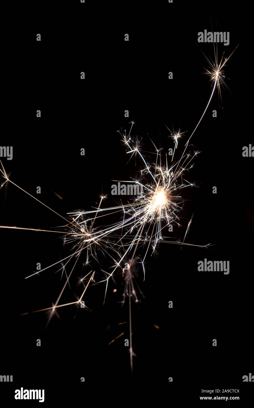 An image of a typical sparkler with dark background Stock Photo - Alamy