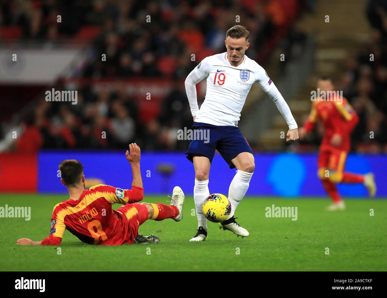 Montenegro's Deni Hocko (left) and England's James Maddison battle for ...
