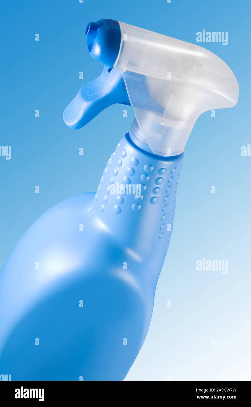Cleaning agent bottle against blue background Stock Photo - Alamy
