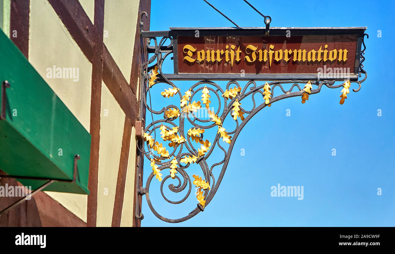 Tourist information as text on an old signboard Stock Photo - Alamy