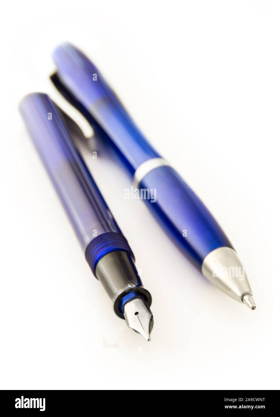 Two blue pencils against white background Stock Photo - Alamy