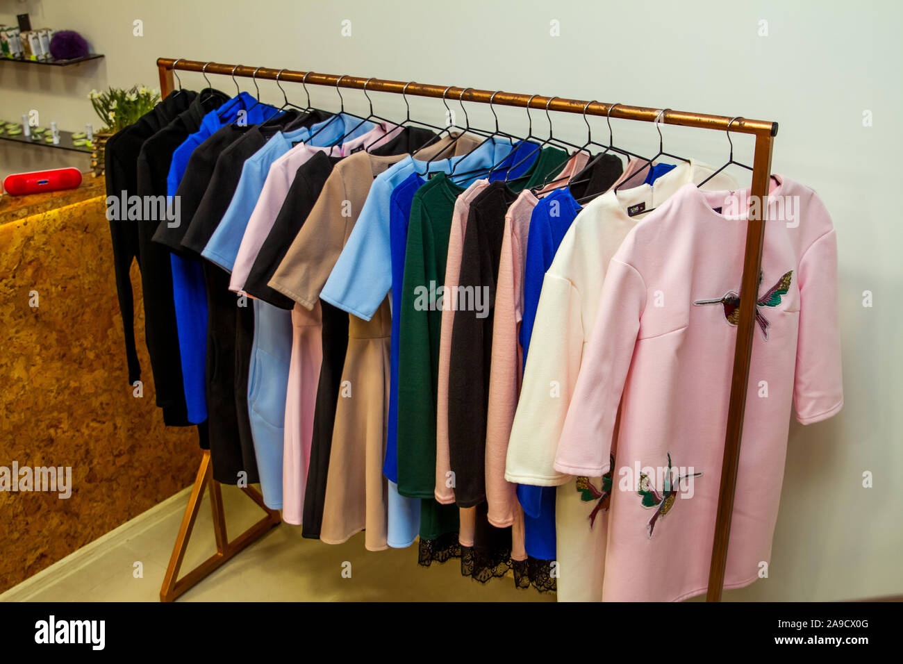 Colorful collection of women's clothes hanging on a rack Stock Photo ...