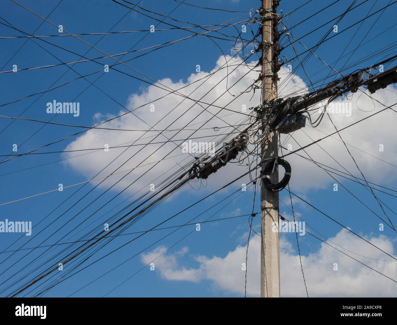 Electric wires in a street concrete pole Stock Photo - Alamy