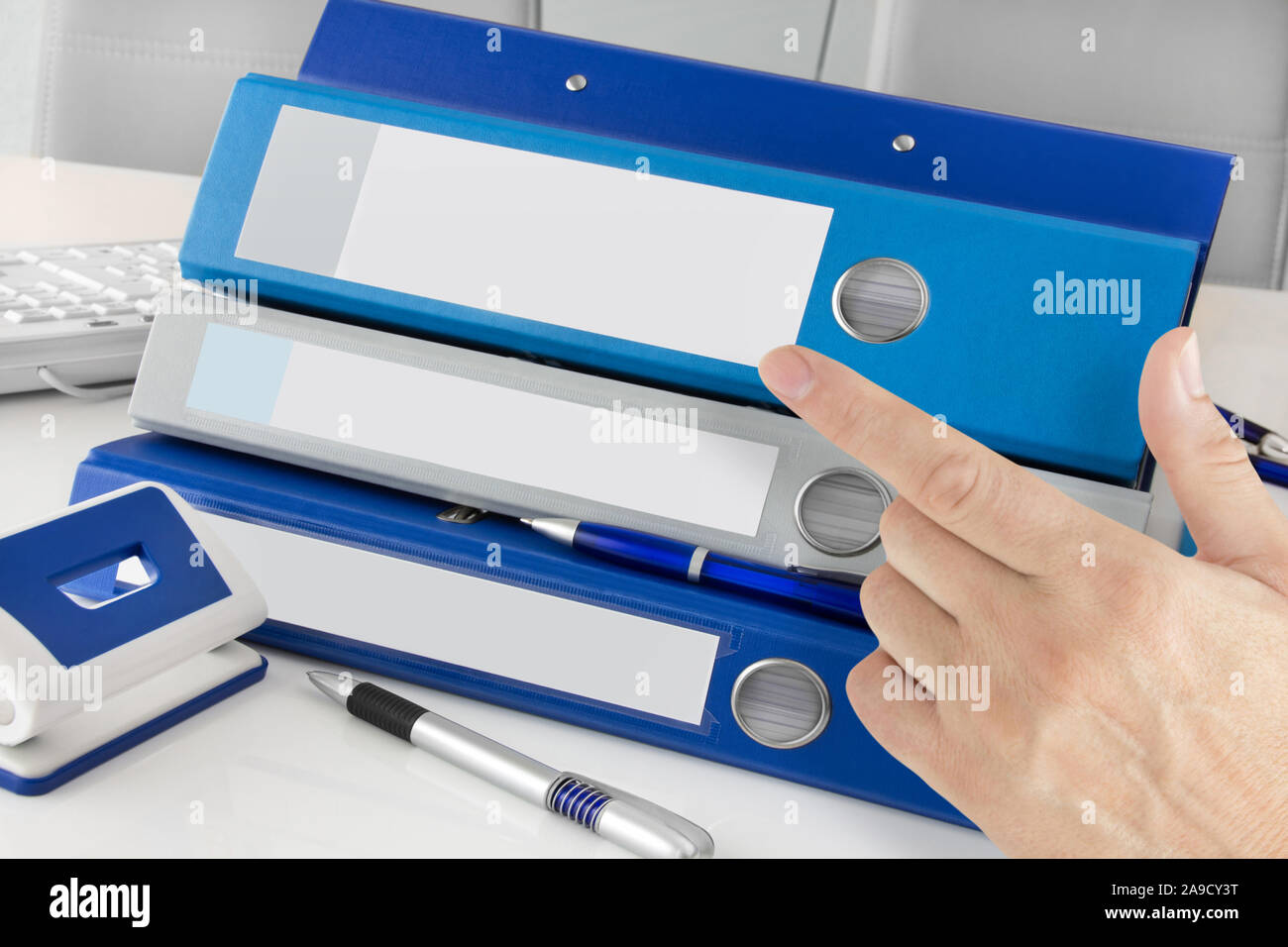 Business male hand and folders Stock Photo - Alamy