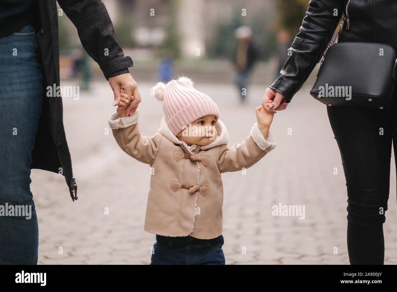 Cute little baby walking in the park with mother. Autumn Stock Photo ...