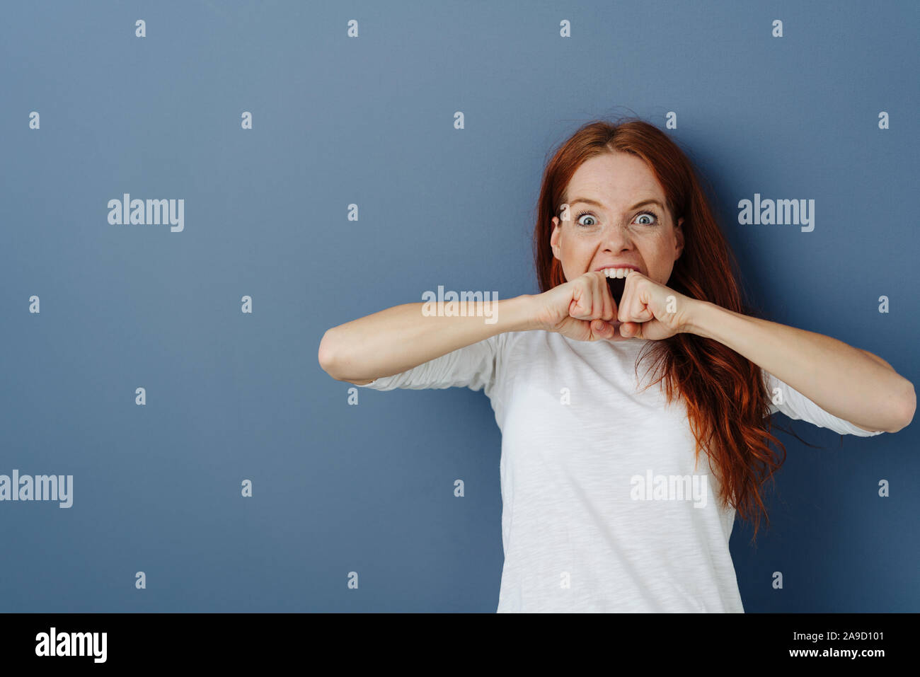 Angry young woman glaring camera hi-res stock photography and images ...