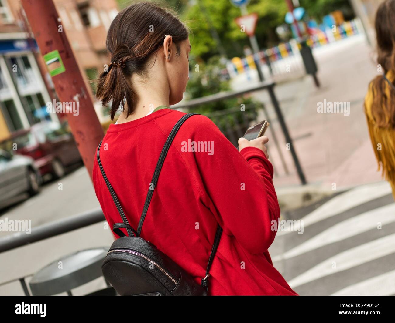 Woman walking using smartphone hi-res stock photography and images - Alamy