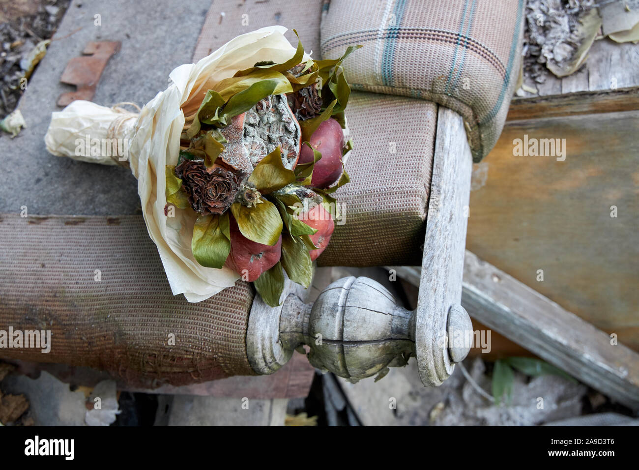 Bunch of rotten fruit and wilted flowers as a symbol of a destroyed old ...