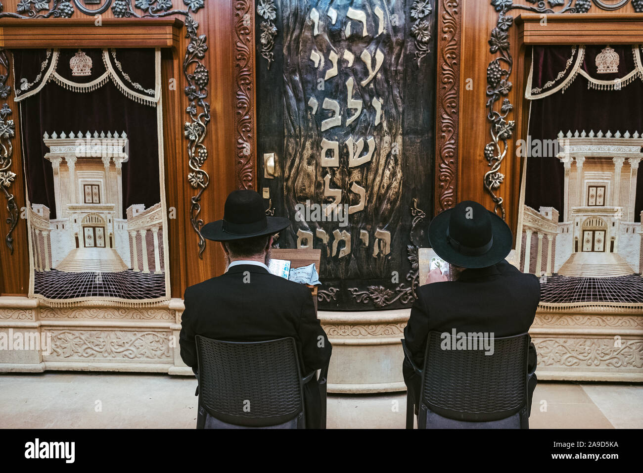 Two strictly orthodox Jewish men praying in a synagogue Stock Photo - Alamy