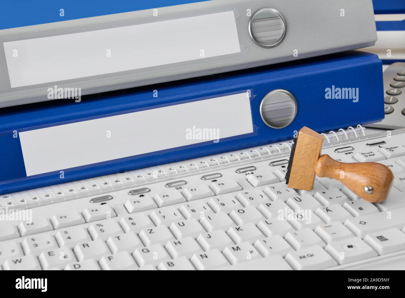Office work blue file folder and Computer Stock Photo - Alamy