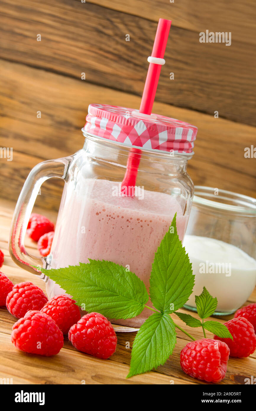 Glass of raspberry yoghurt drink Stock Photo - Alamy