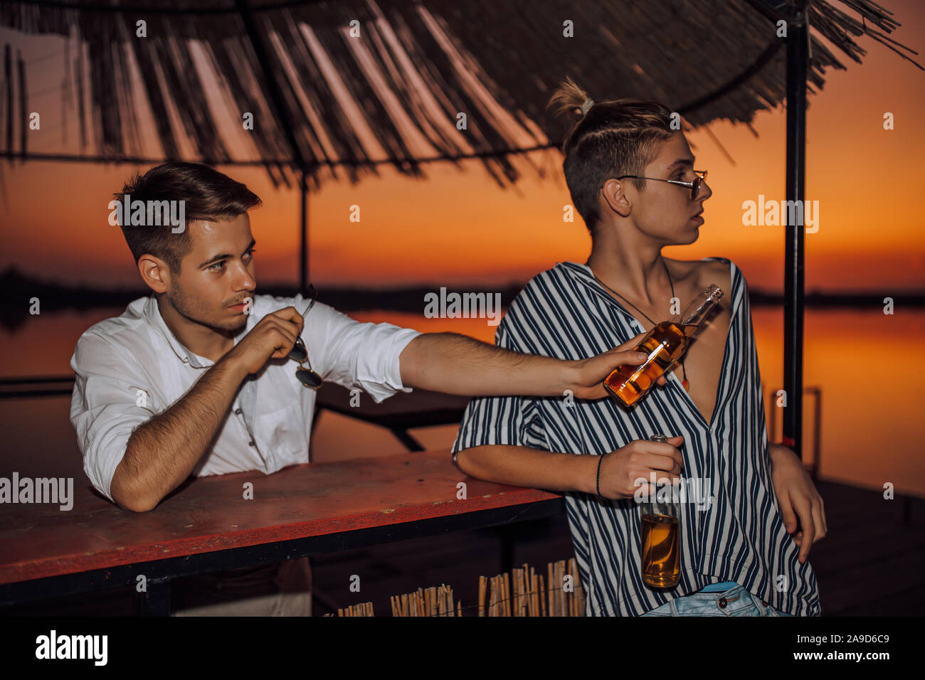 Two friends having a beer in a bar hi-res stock photography and images ...