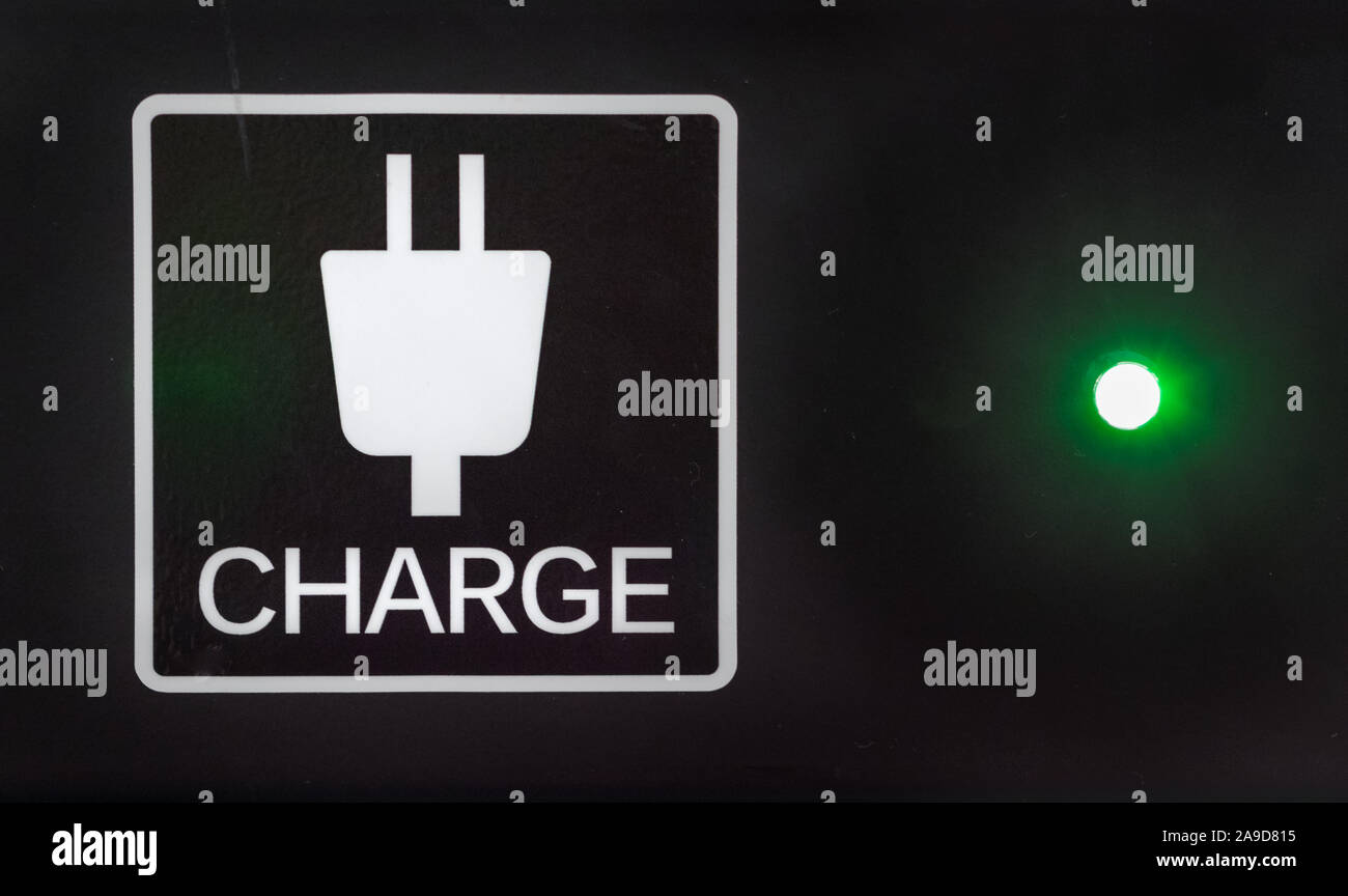 Free public mobile charge sign with a green light Stock Photo - Alamy