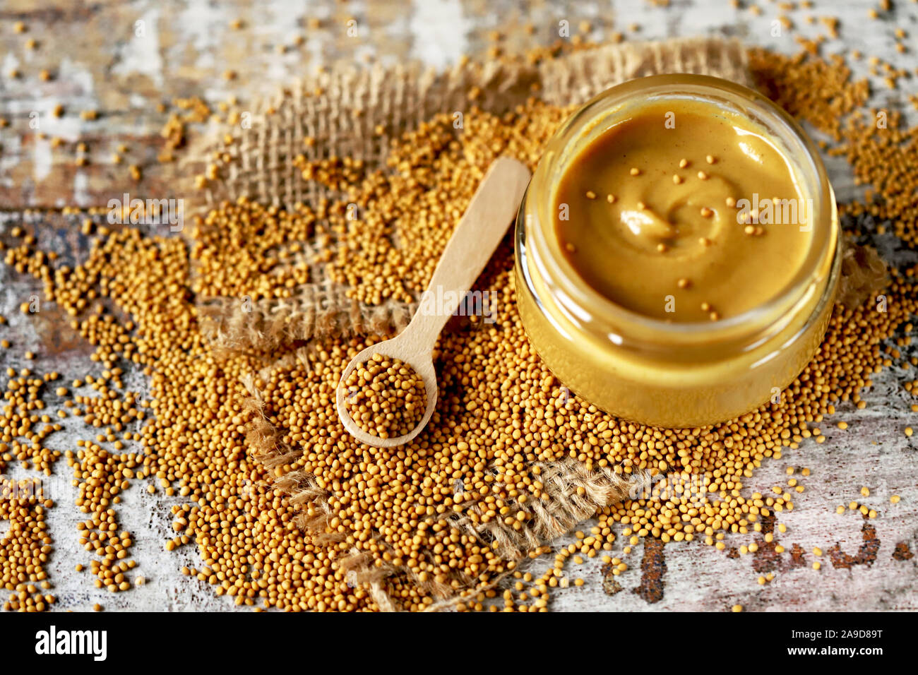 Natural mustard in a jar. Grains of mustard. Homemade mustard. Organic ...