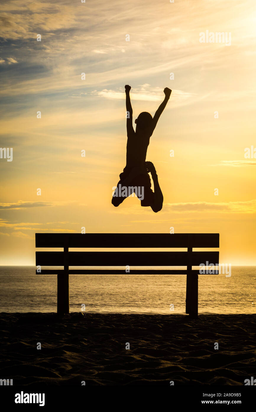 Kids jumping beach sunset hi-res stock photography and images - Alamy