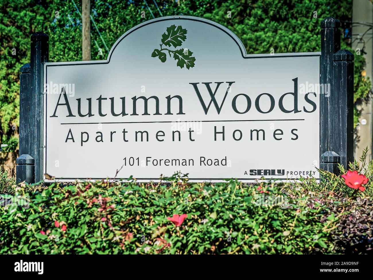 An entrance sign welcomes residents to Autumn Woods apartment homes ...