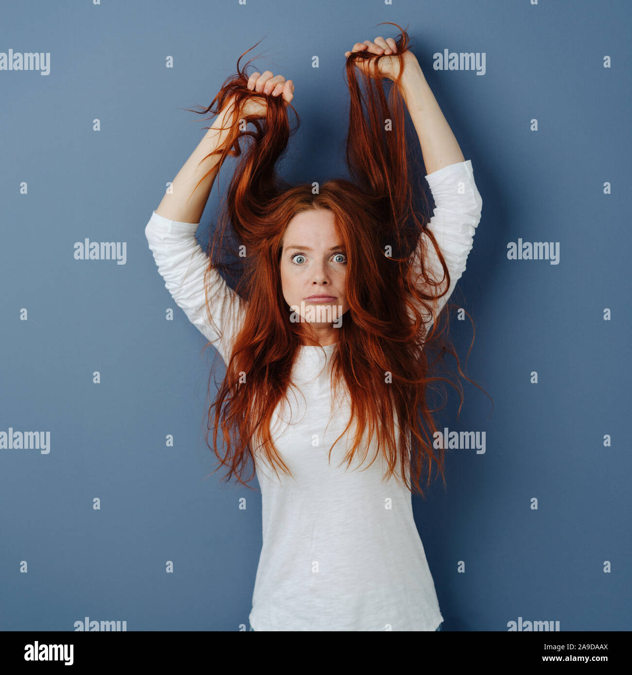 Angry young woman glaring camera hi-res stock photography and images ...