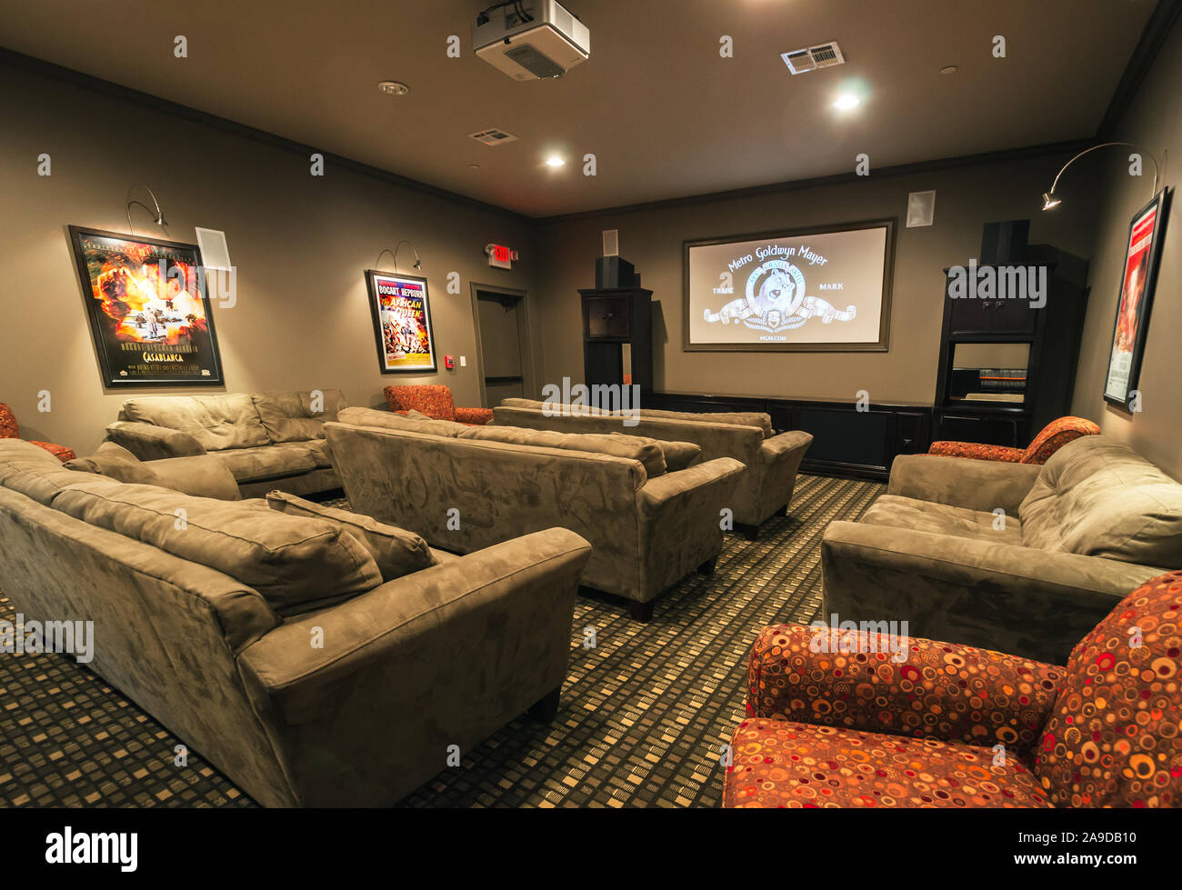 The clubhouse features a home theater at Cypress Cove Apartment Homes ...