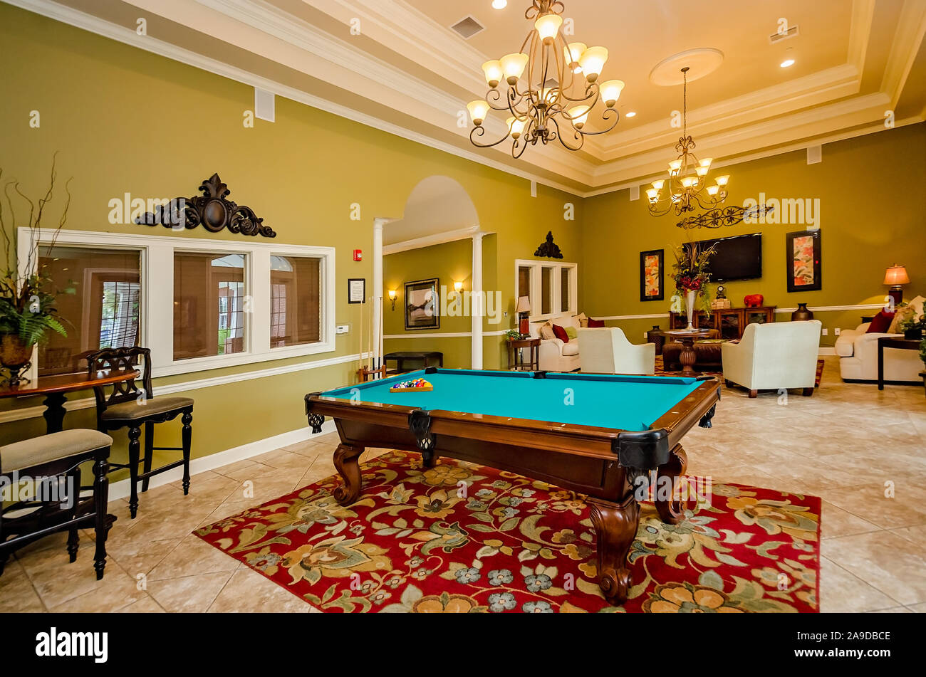 The clubhouse includes a pool table at Cypress Cove Apartment Homes in ...