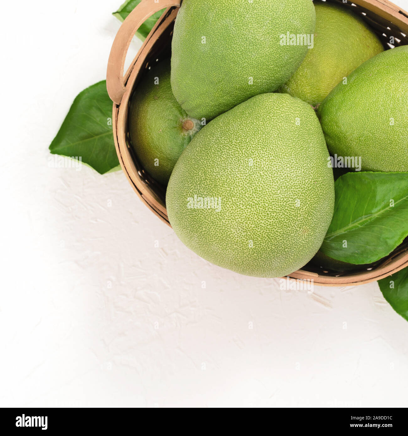 Fresh pomelo, pummelo, grapefruit, shaddock on white cement background ...