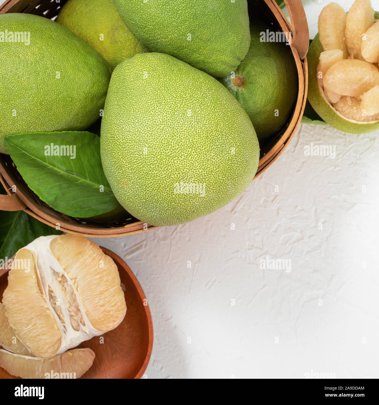 Fresh pomelo, pummelo, grapefruit, shaddock on white cement background ...