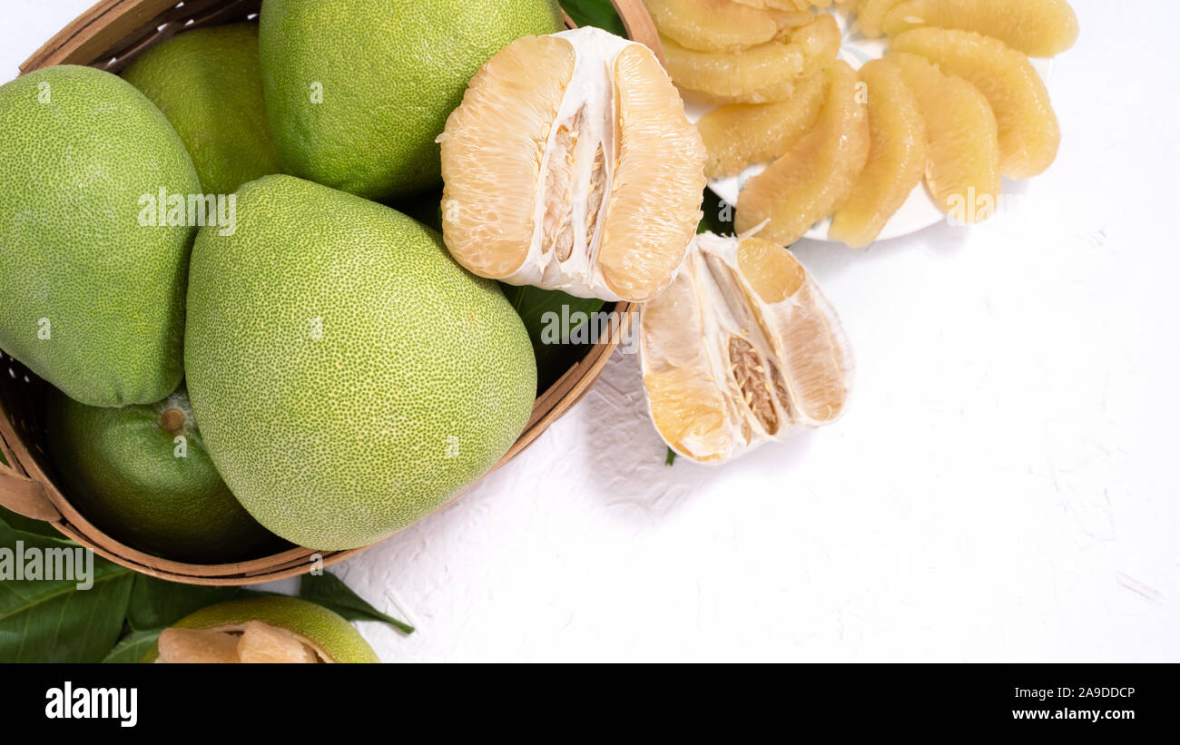 Fresh pomelo, pummelo, grapefruit, shaddock on white cement background ...