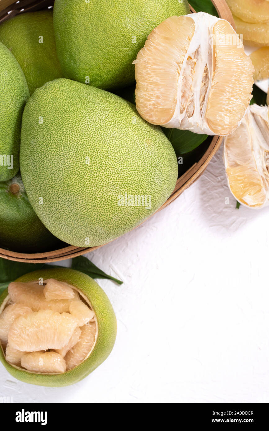 Fresh pomelo, pummelo, grapefruit, shaddock on white cement background ...