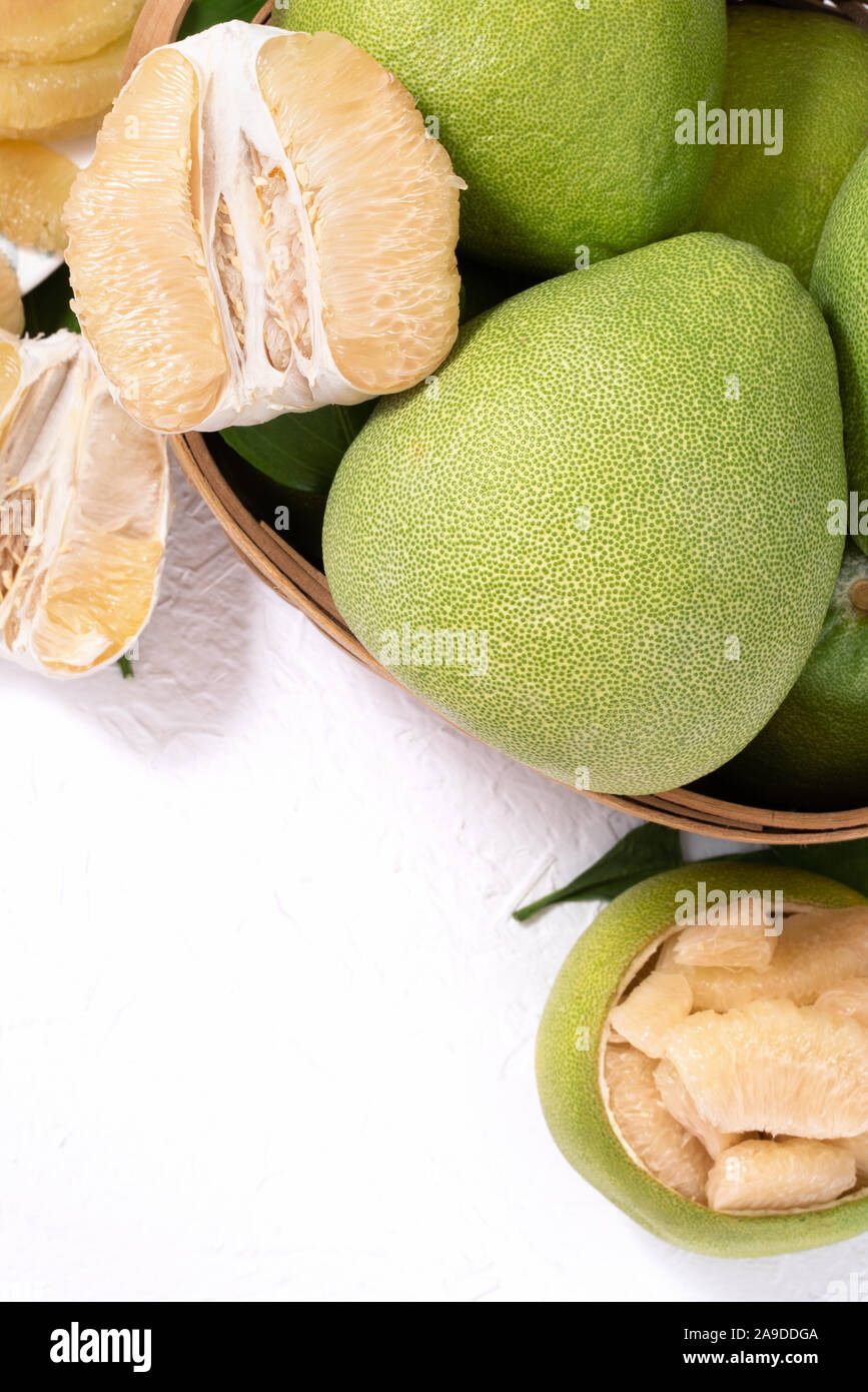 Fresh pomelo, pummelo, grapefruit, shaddock on white cement background ...