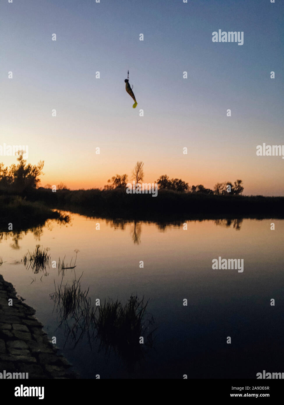 Fishing on the Oderbruch, evening mood Stock Photo - Alamy
