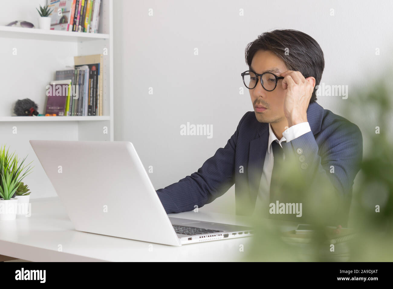 Asian Financial Advisor or Asian Consulting Businessman Analyze ...