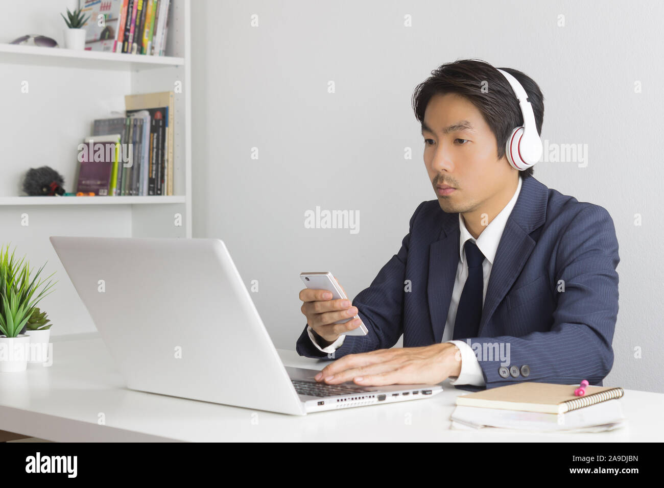 Asian Man Call Center in Suit Wear Headset Answer Customer Questions by ...