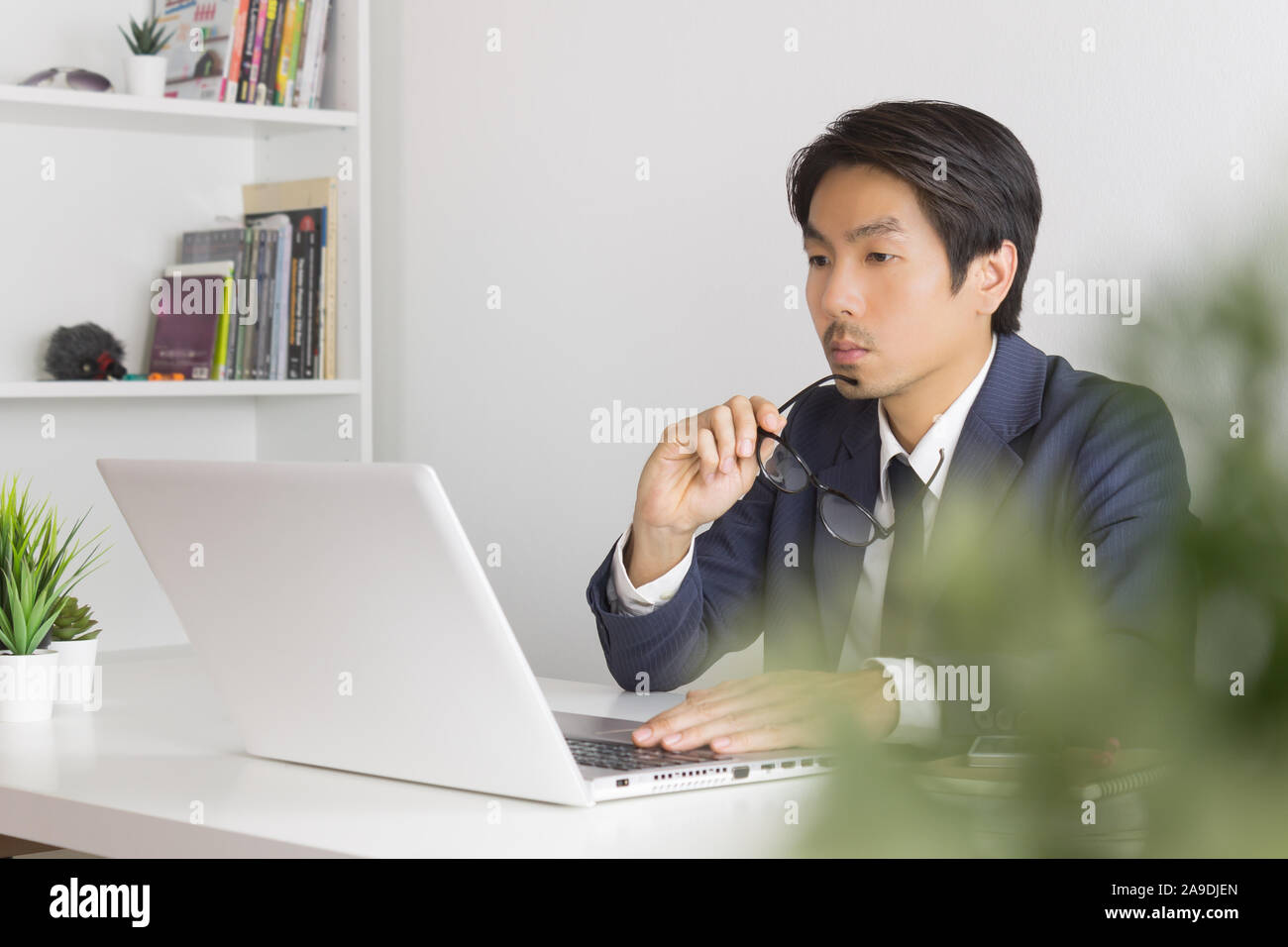 Asian Financial Advisor or Asian Consulting Businessman Serious with ...