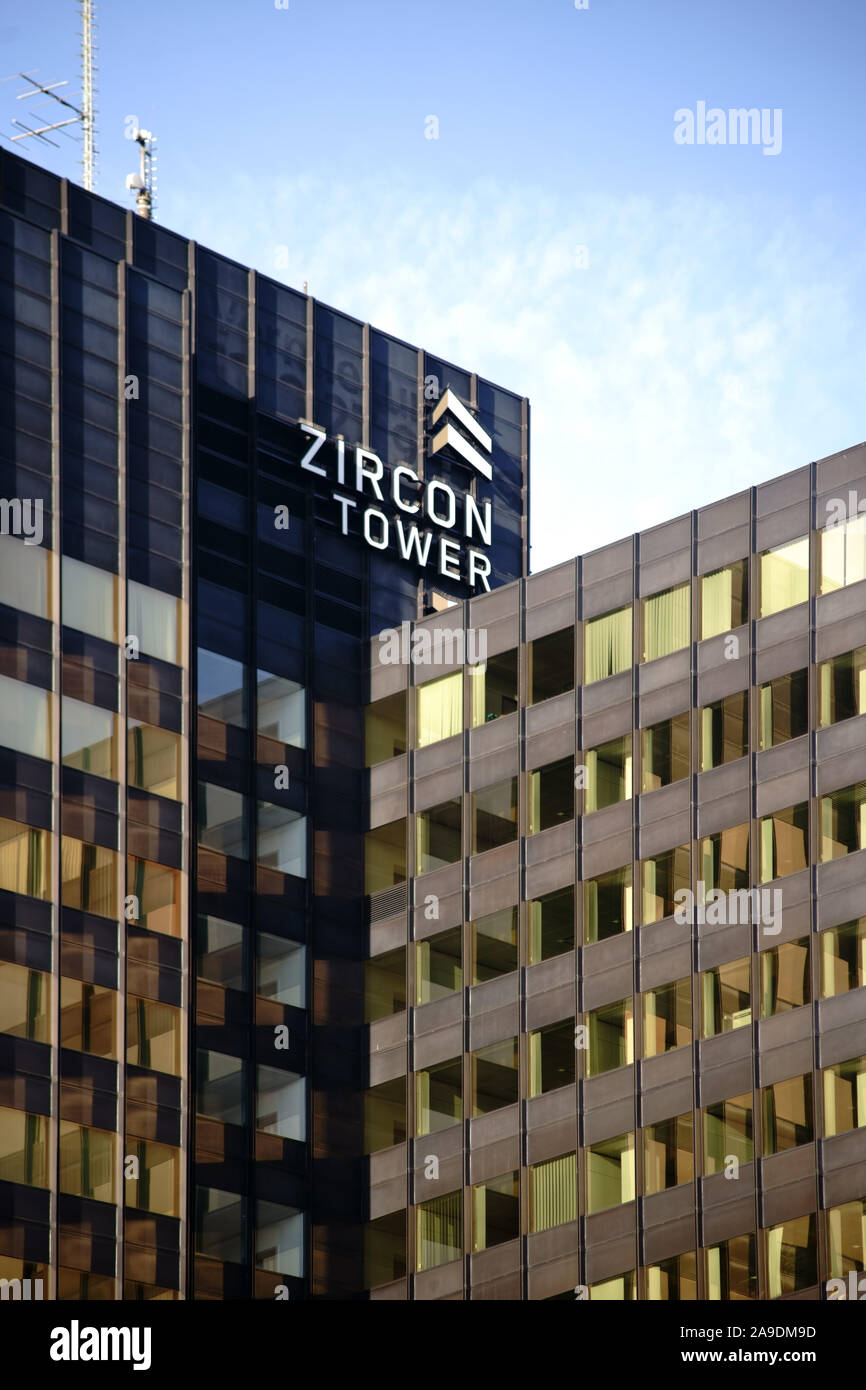 The mirrored glass facade of the modern high-rise building and office ...