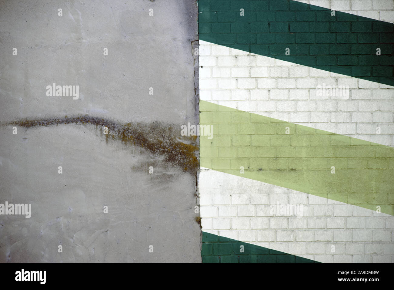 Two house walls side by side with a smooth layer of plaster and painted ...