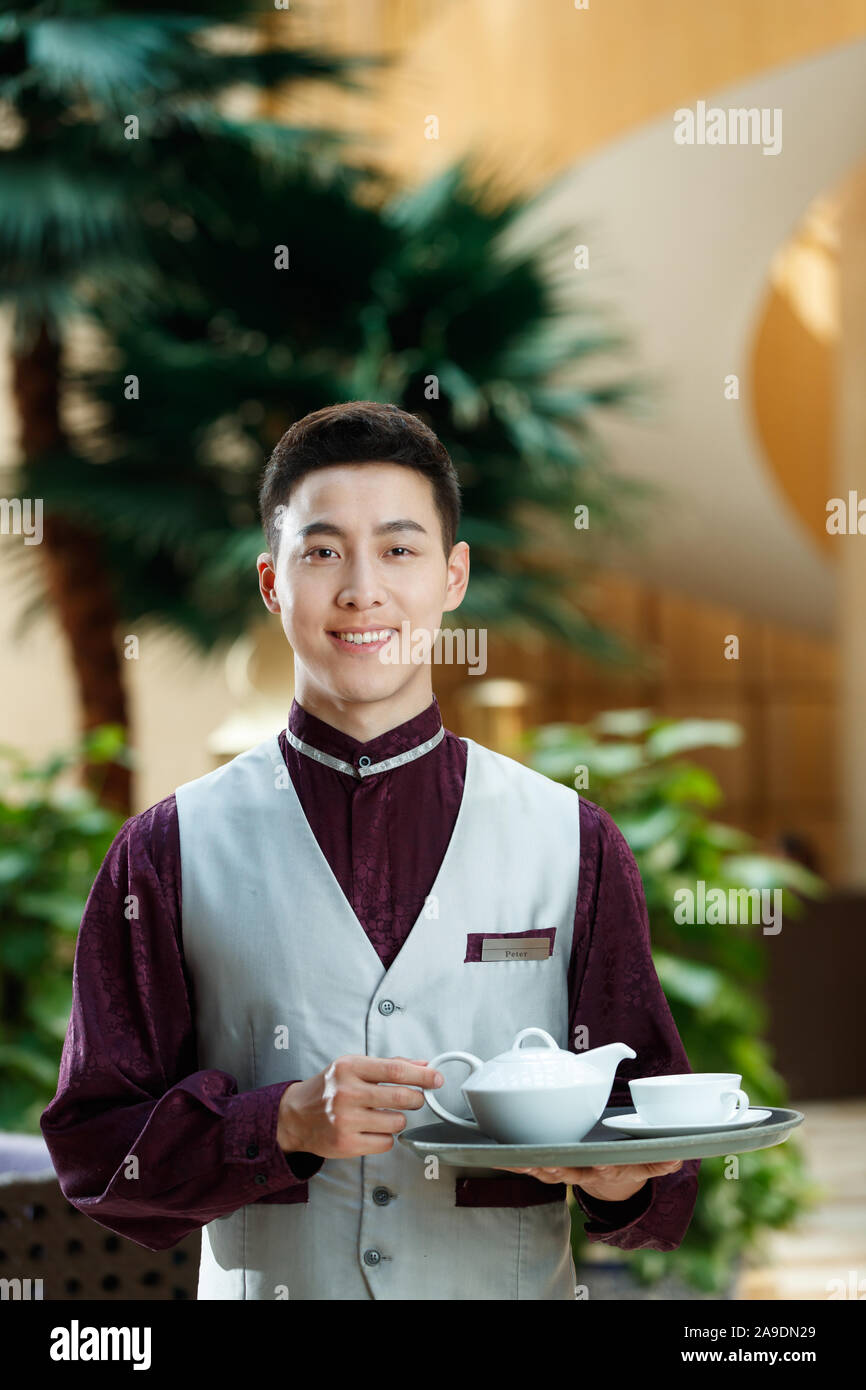 The hotel waiter Stock Photo - Alamy