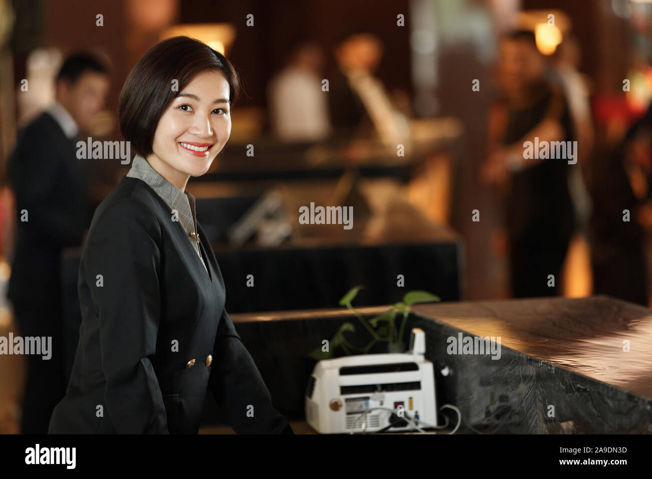 Oriental hotel manager hi-res stock photography and images - Alamy