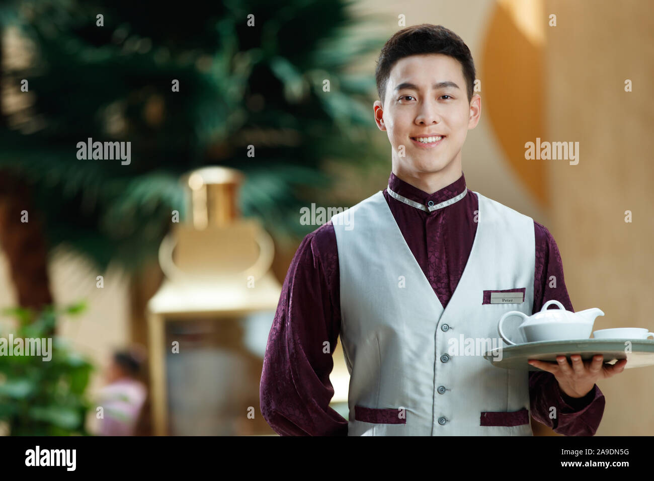 The hotel waiter Stock Photo - Alamy