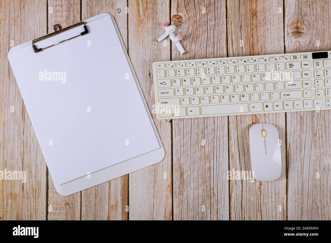 Office table with blank notebook and computer keyboard on a wooden ...